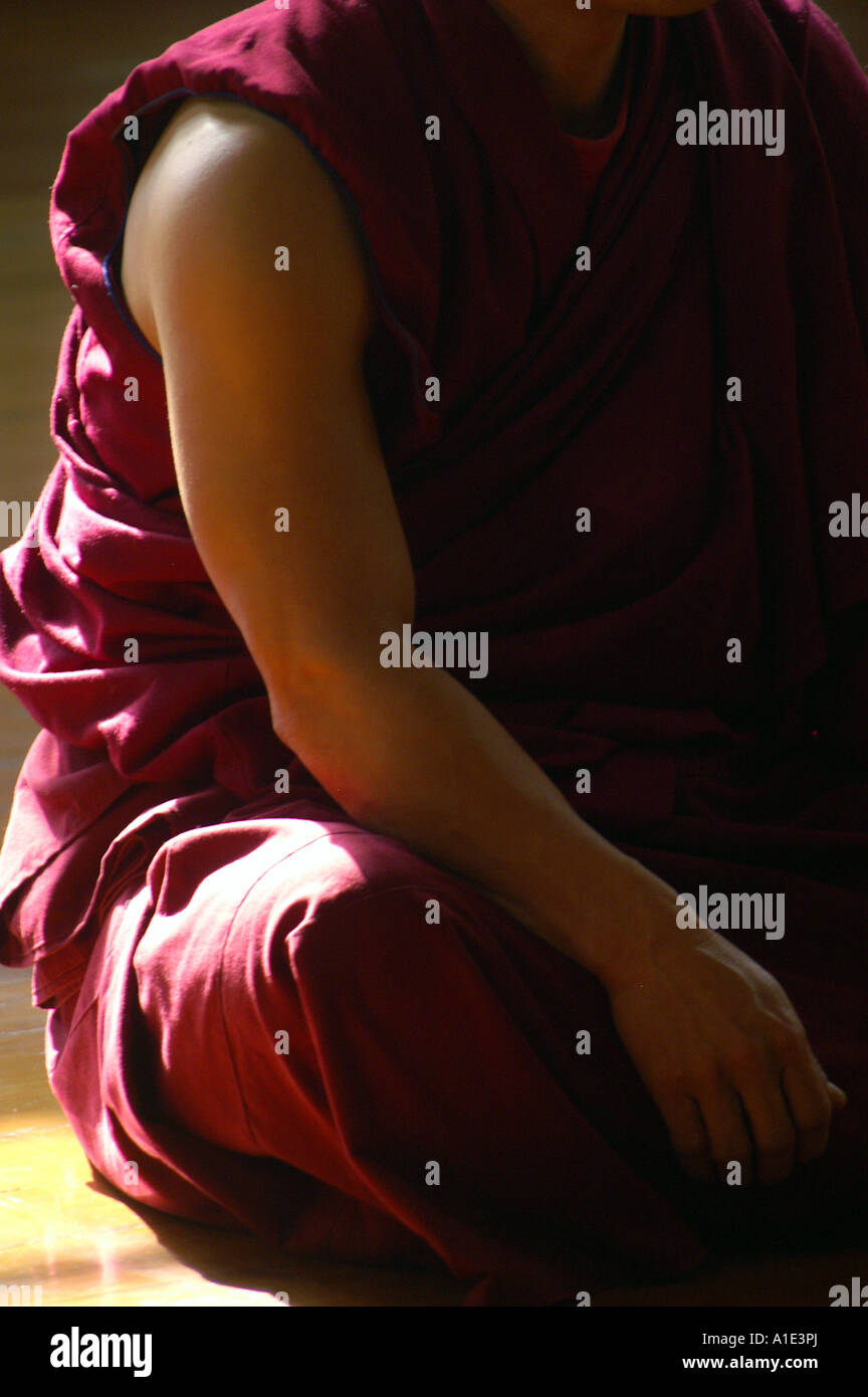 Meditating sitting buddhist tibetan monk in traditional ceremonial robe ...