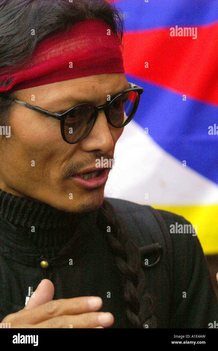 Portrait of tibetan smart man political activist discussing politically ...