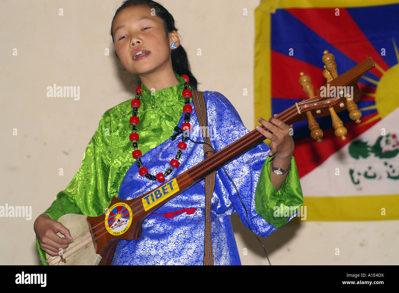 Young girl singer performer of tibetan arts music in front of national ...