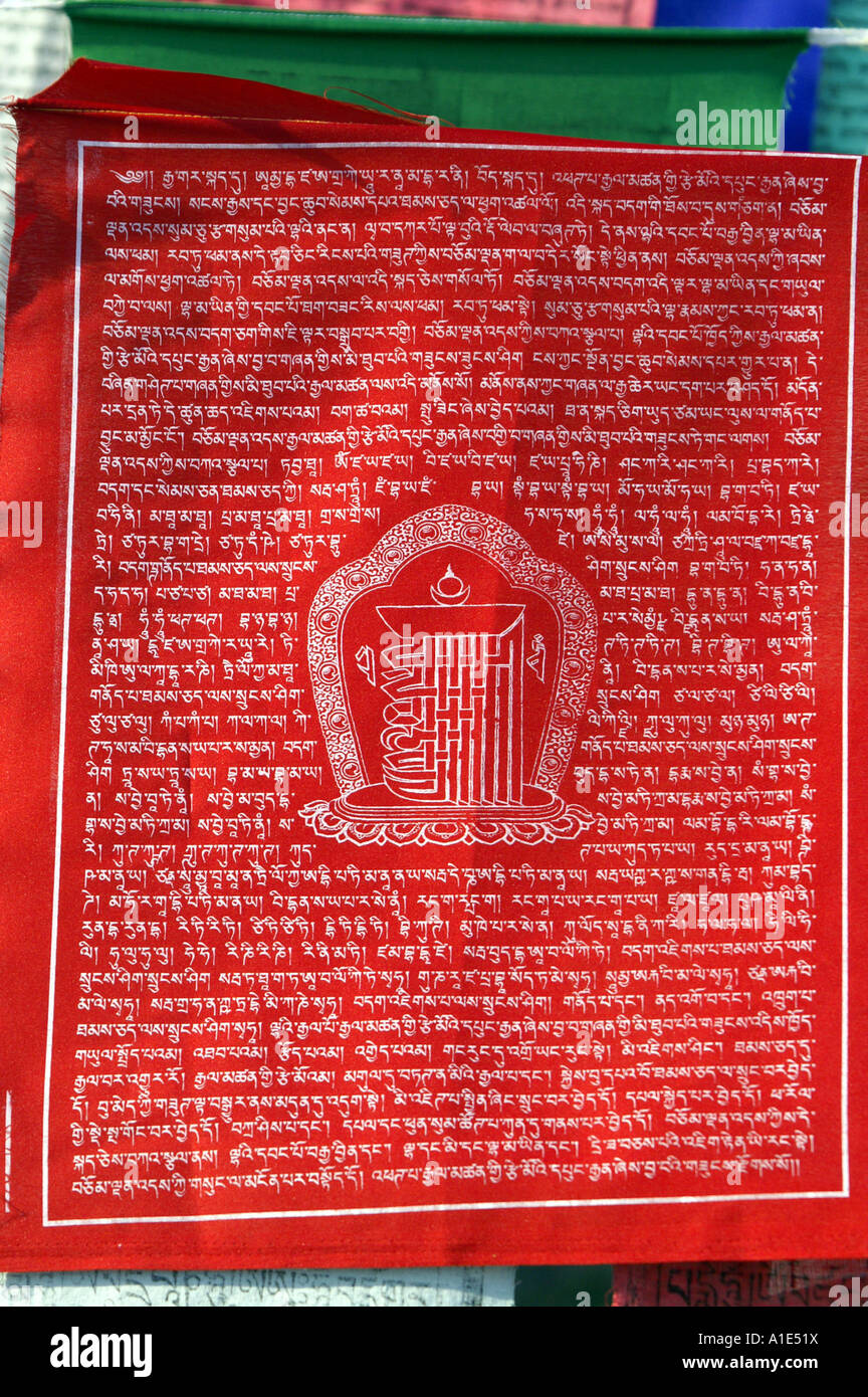 Sri Kalachakra Tantra buddhist prayer flag detail on red background ...