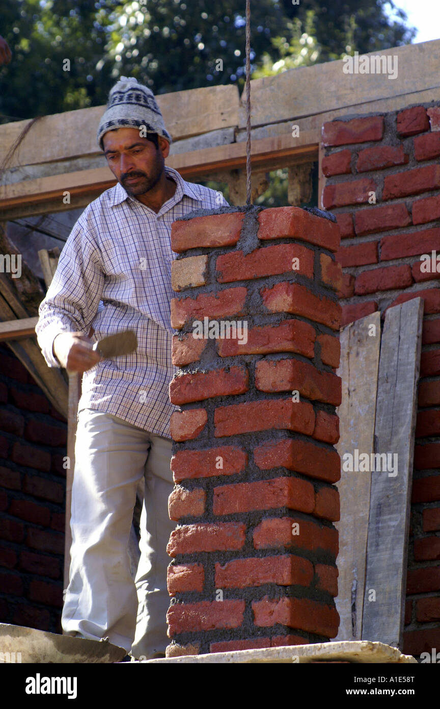 Indian man bricklayer building brick hi-res stock photography and ...