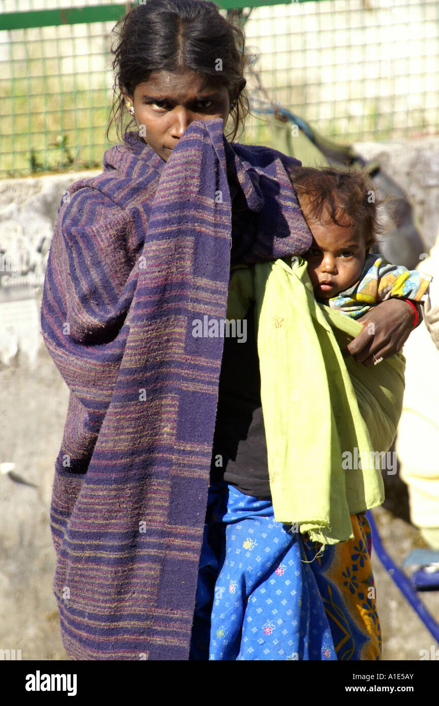 Young native indian beggar woman girl mother crying holding her kid ...