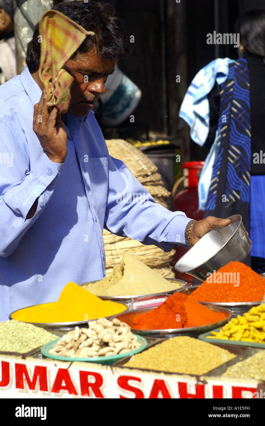 Indan man selling colourful indian spices so called curry on Paharganj ...