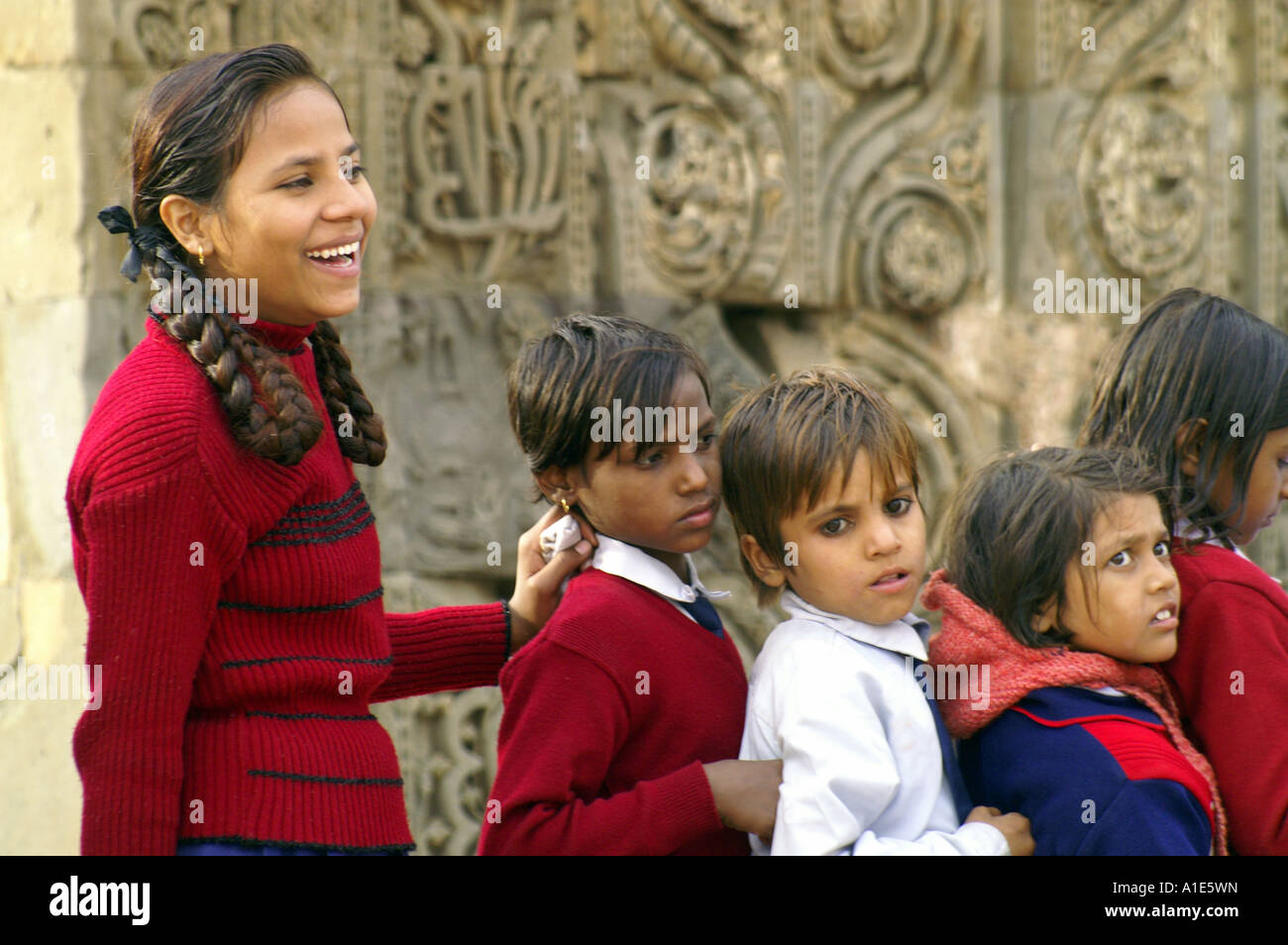 Young indian child kid girl boy school trip at Qutb Minar in New Delhi ...