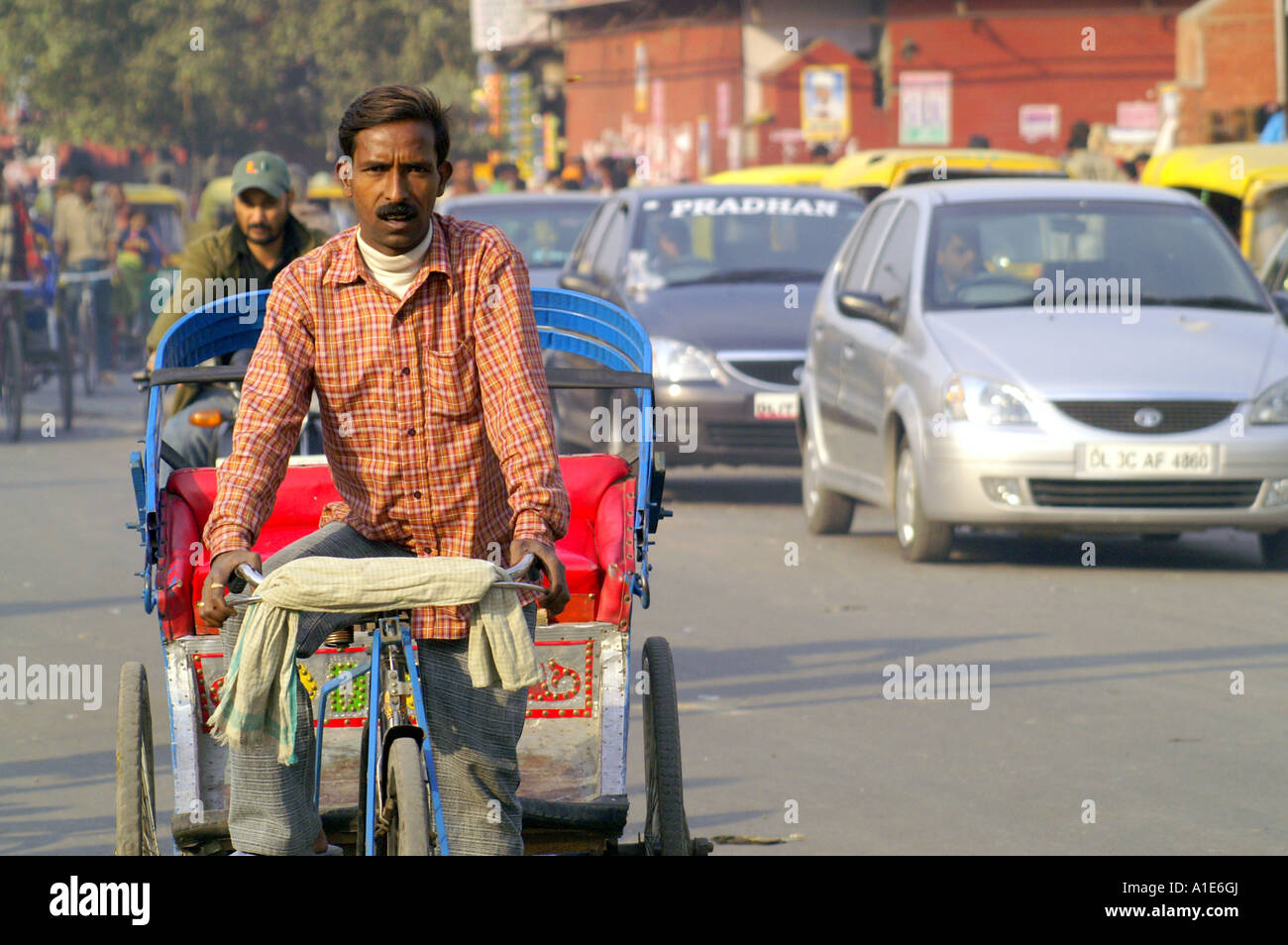 Rickshaw bicycle and modern cars - changing India trasport, street of ...