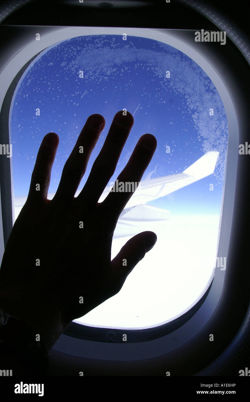 Round window of airbus plane airplane wing above thick white bright ...