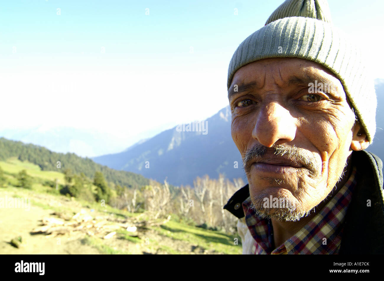Portrait face of very old indian man highlander at alpine meadow in ...