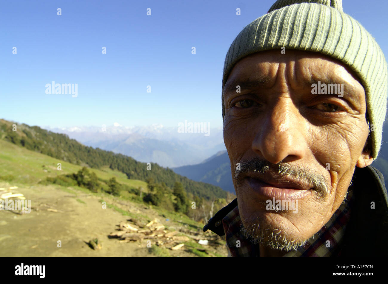 Portrait face of very old indian man highlander at alpine meadow in ...