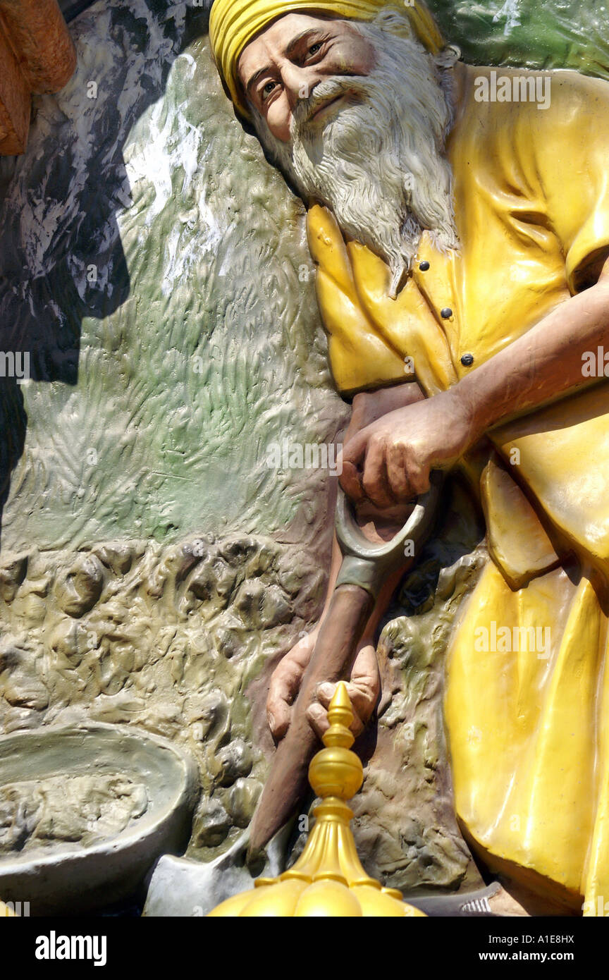 Sikh guru digging a hole at Manikaran hot spring gurudwara, Parvati ...