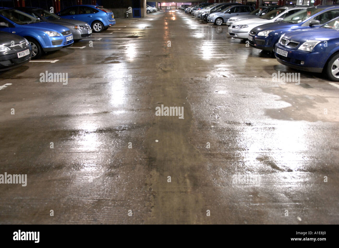 multi storey car park parkng motor cars night evening desolate alone ...