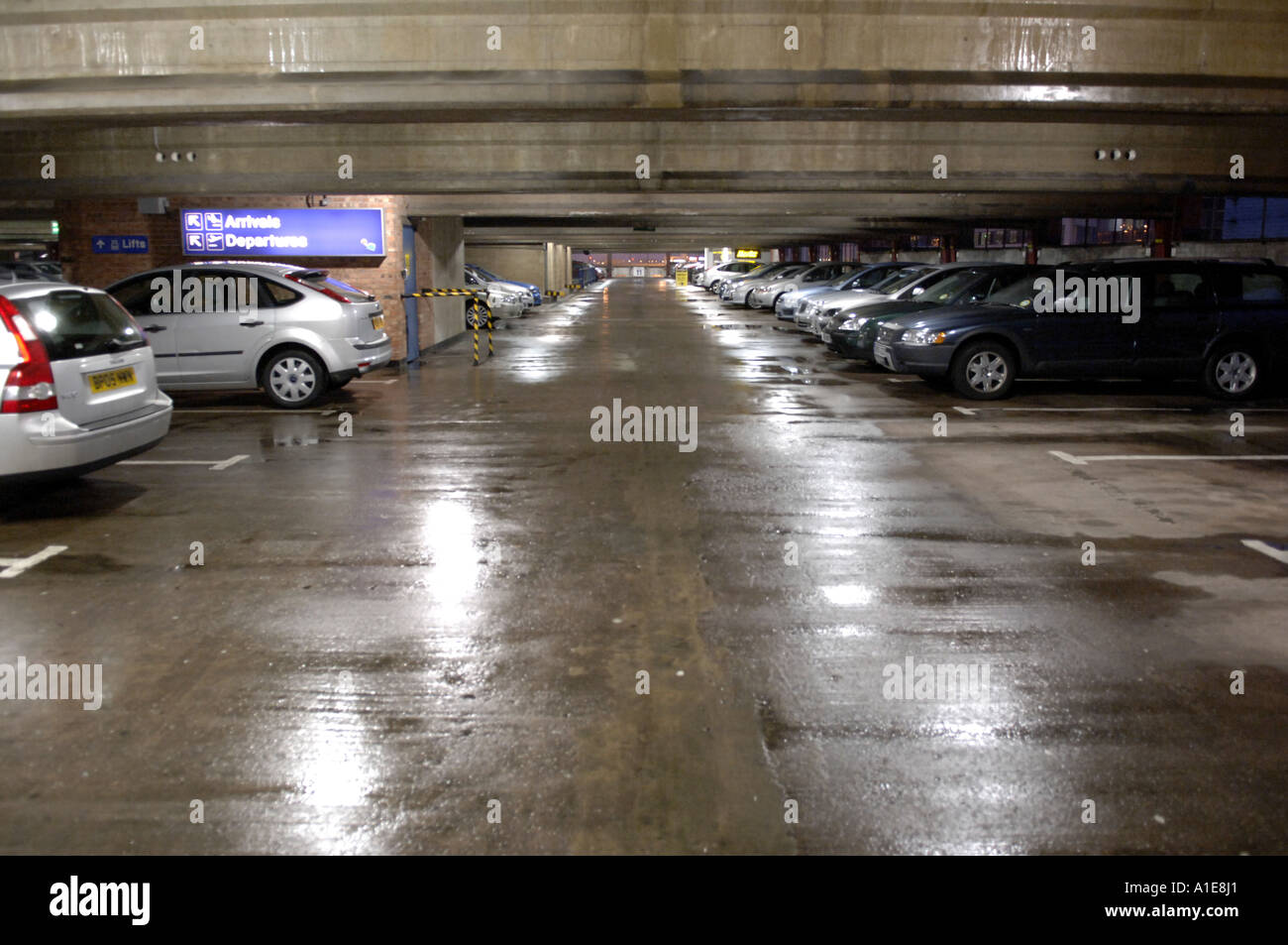 multi storey car park parkng motor cars night evening desolate alone ...
