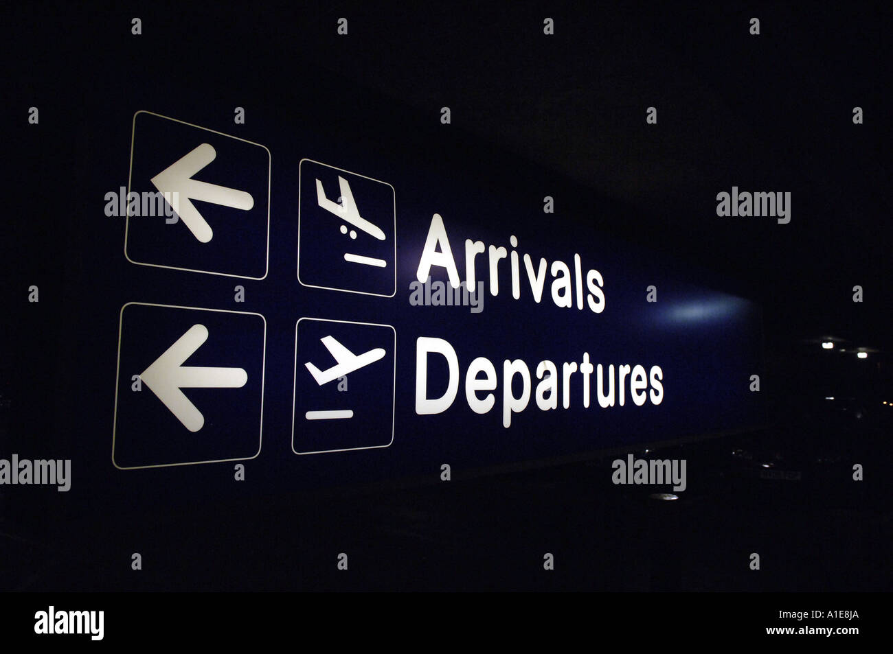 blue arrivals departures sign night dark manchester airport flights ...