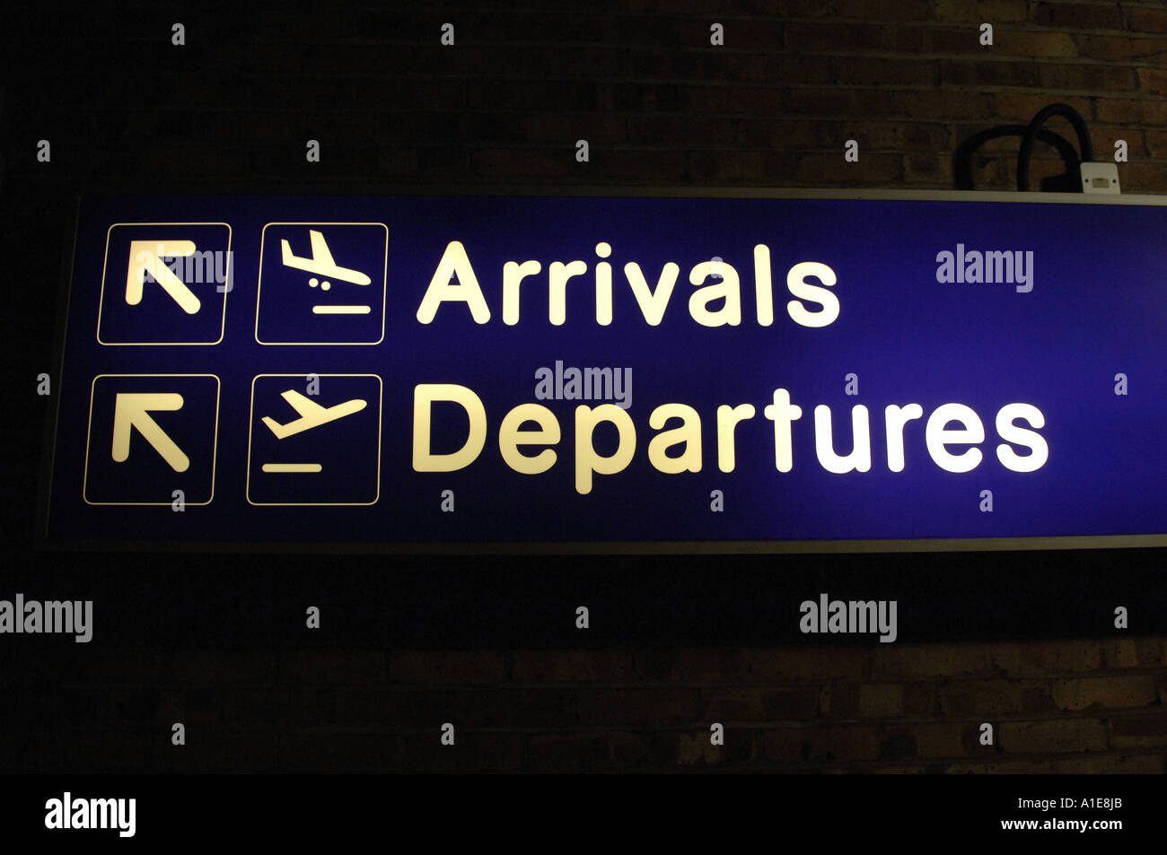 blue arrivals departures sign night dark manchester airport flights ...