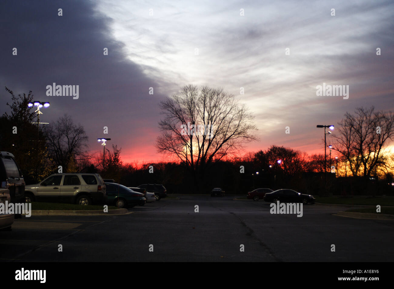 Sunset seen from the company parking lot Stock Photo - Alamy