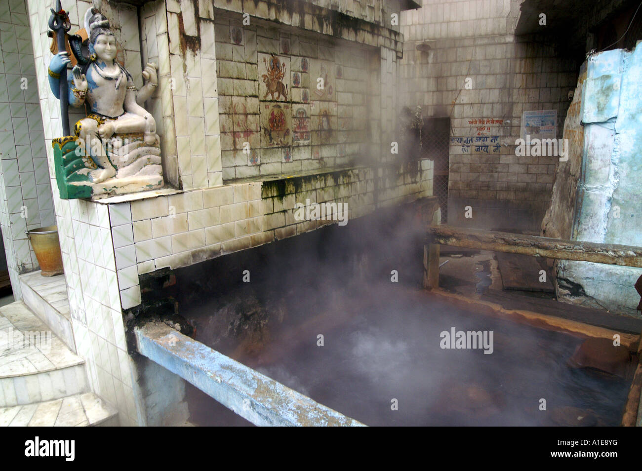 Boiling water pool in hot springs hindu temple of Manikaran, northern ...