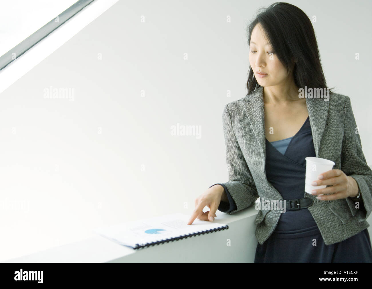 Asian businesswoman looking documents hi-res stock photography and ...