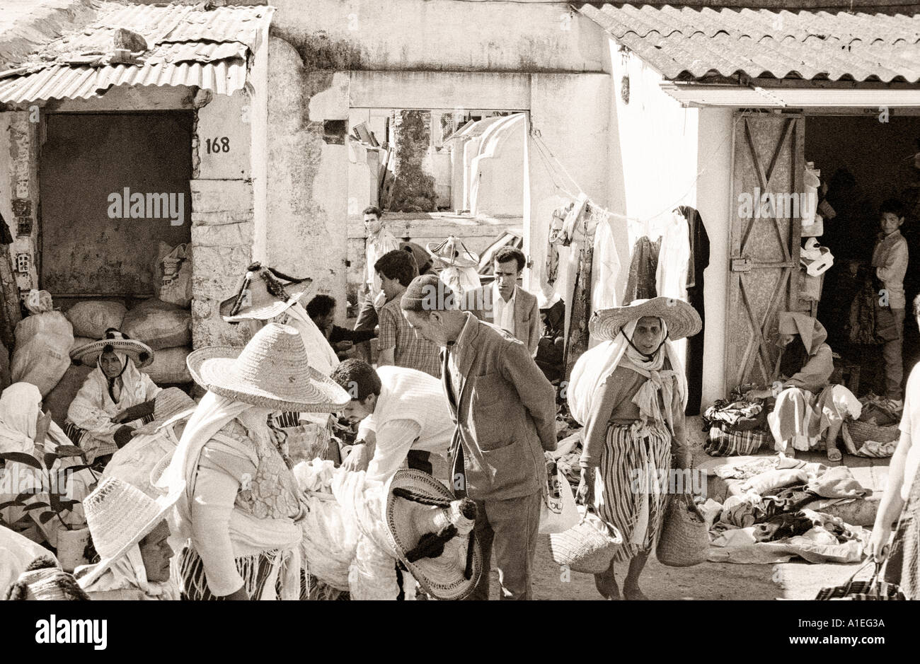 AFRICA MOROCCO TANGIER Berber women in traditional dress selling ...