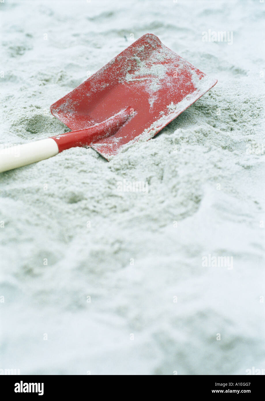 Shovel on sand Stock Photo - Alamy