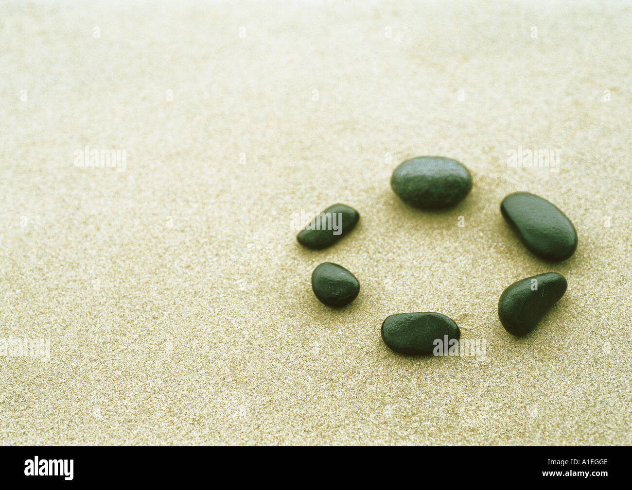 Pebbles in circle on beach Stock Photo - Alamy