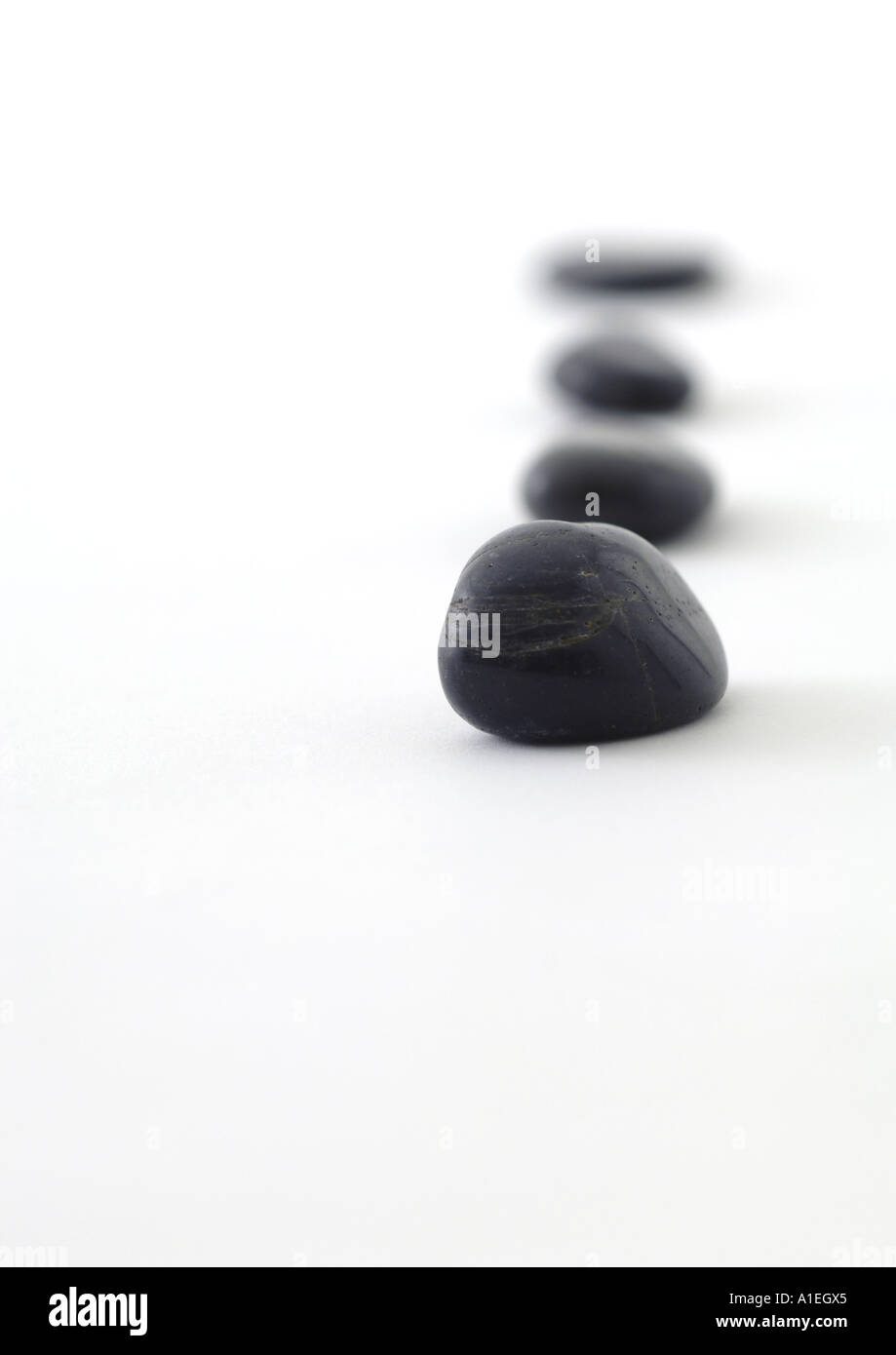 Stones lined up Stock Photo - Alamy