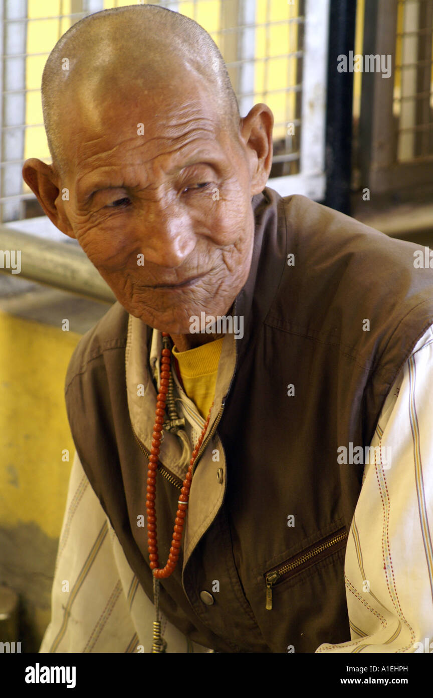 Old tibetan man buddhist with beads necklace sitting in Namgyal ...
