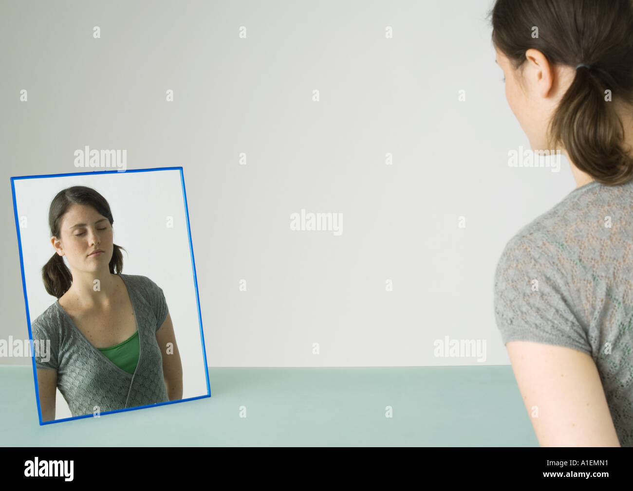 Facing mirror sad hi-res stock photography and images - Alamy