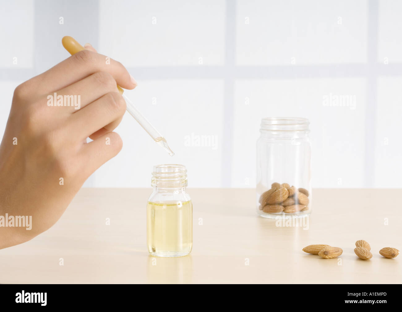 Women holding dropper bottle hi-res stock photography and images - Alamy