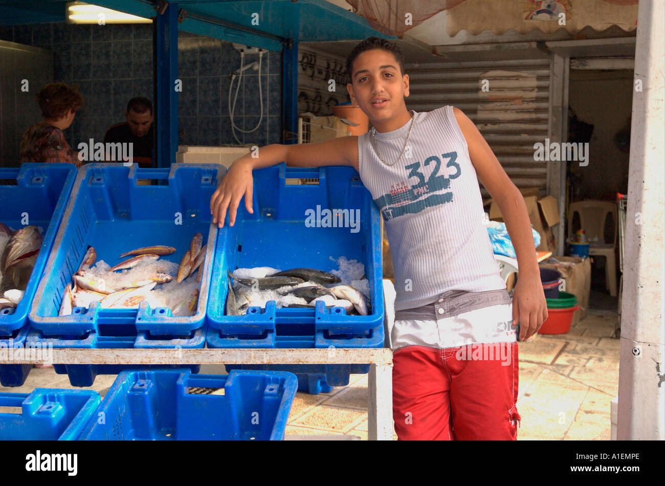 young boy selling fish in an open air market Haifa Israel Stock Photo ...