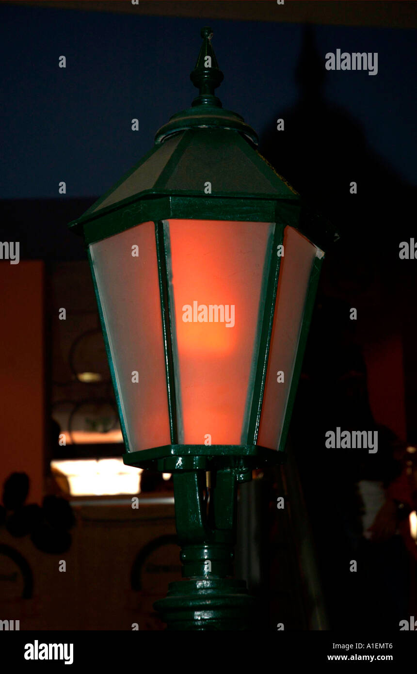 a lit outdoor old style lamp post at night Stock Photo - Alamy