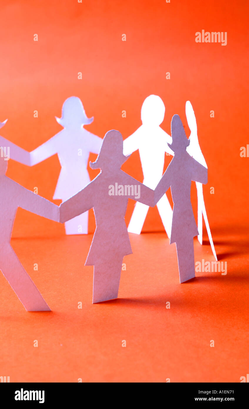 Paper Dolls on an orange background Stock Photo - Alamy