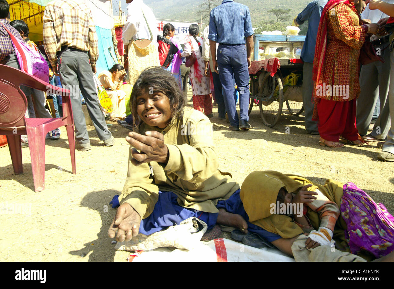 Crying desperate impoverished professional beggar woman at Dussehra ...