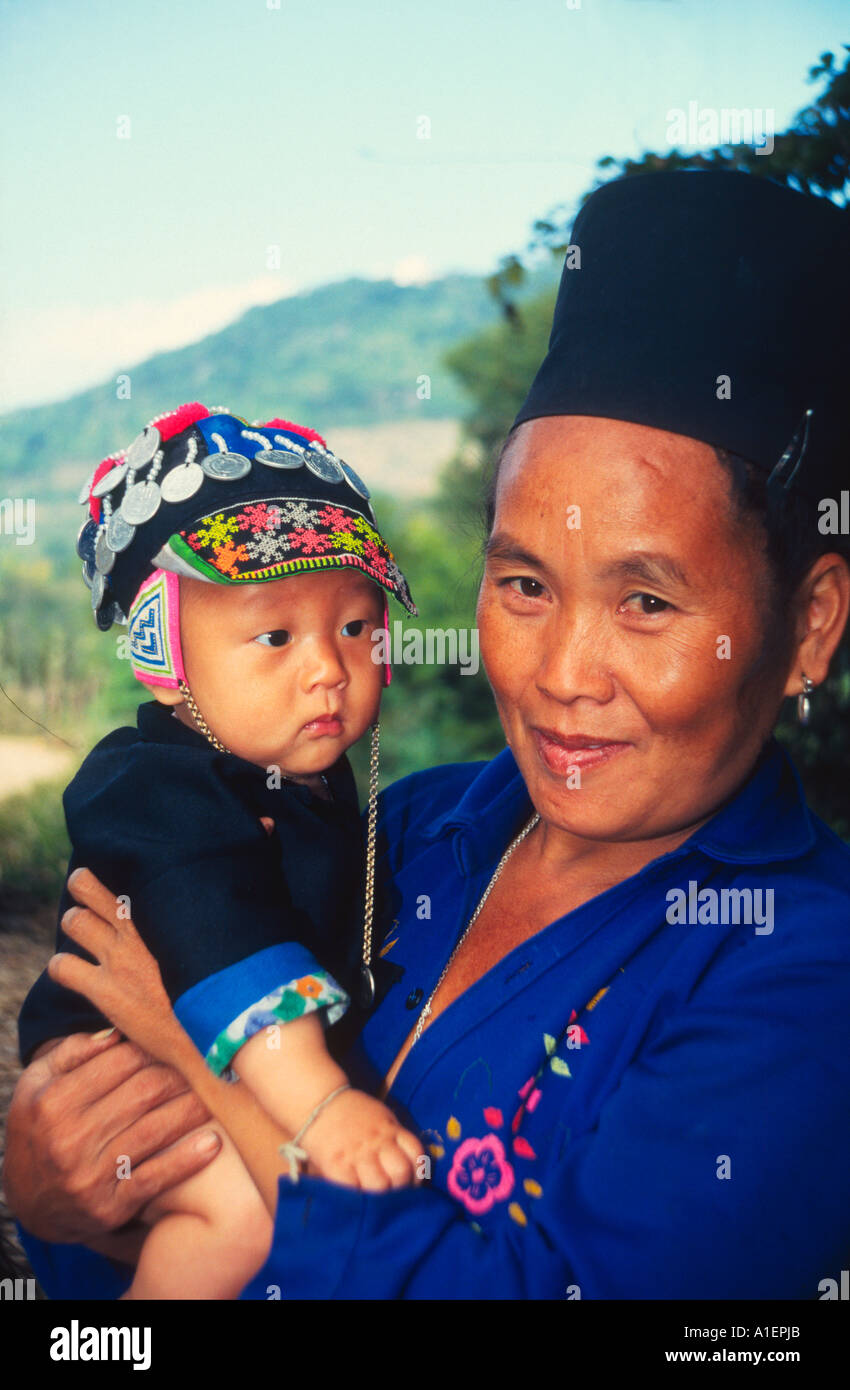 Hmong mother and child in traditional dress, and decorated head gear ...