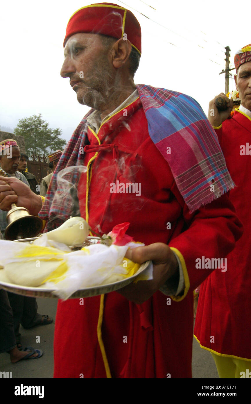 Priests ringing bell and carrying holy items at Dussehra fair festival ...