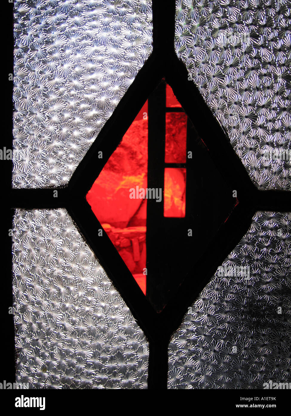 Diamond shaped stained glass window of a church Stock Photo - Alamy