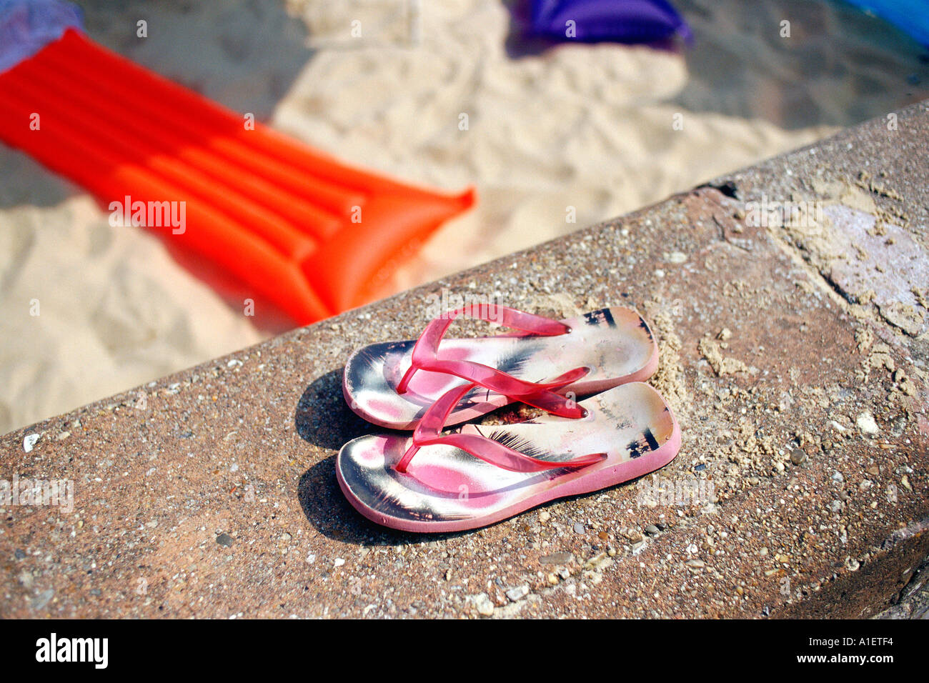 Flip-flops on the beach Stock Photo - Alamy