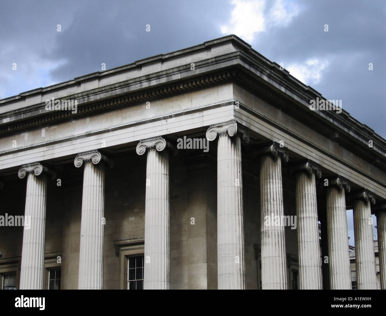 British Museum vertical columns to side of entrance with cloudy sky ...