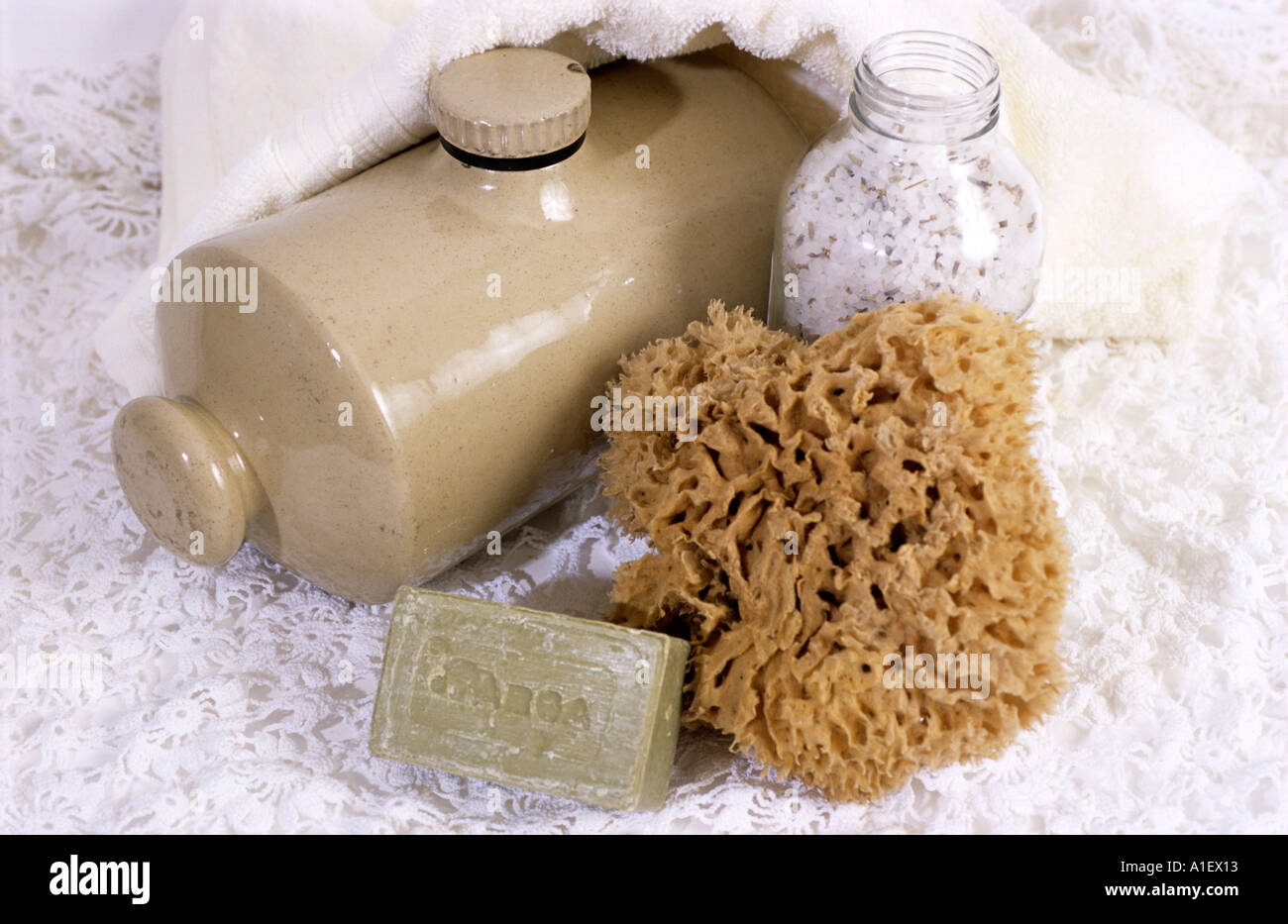 Still life Antique stone hot water bottle natural sponge bar of green ...