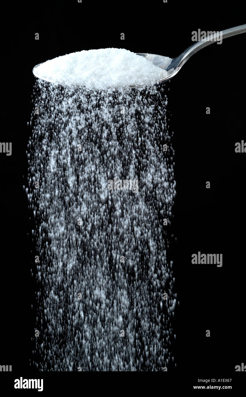 pouring a spoonful of sugar Stock Photo - Alamy