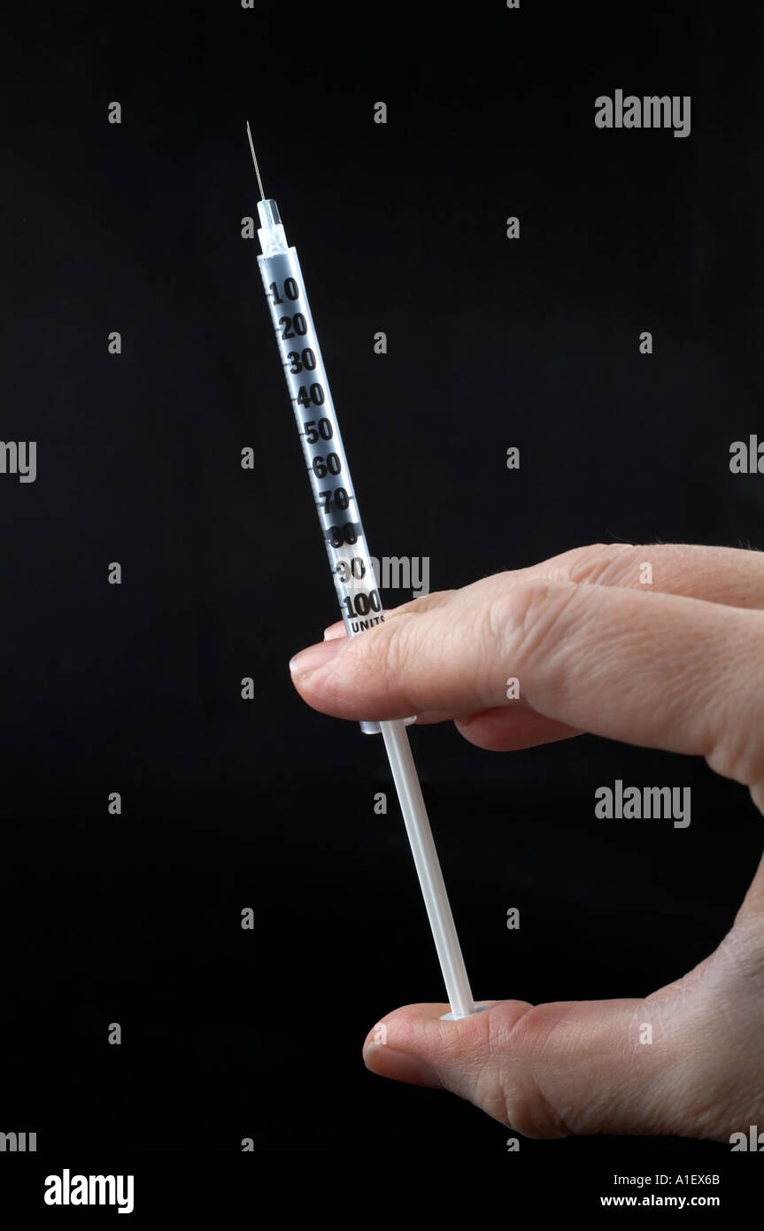 hand with a syringe Stock Photo - Alamy