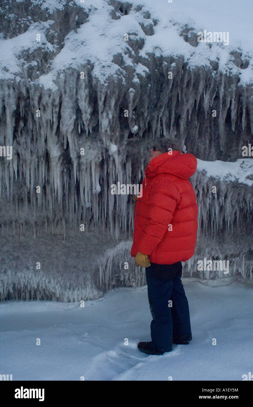 Shannon Coykendall checks out icicles on frozen coastal erosion Barter ...