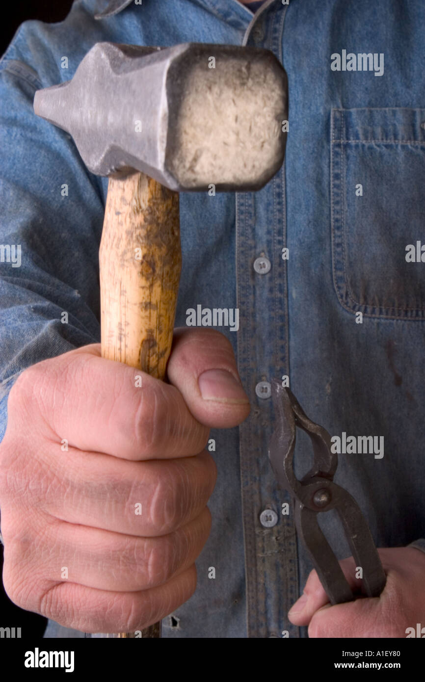 Hand and Hammer Stock Photo - Alamy