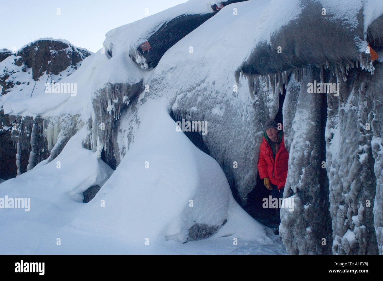 Shannon Coykendall checks out icicles on frozen coastal erosion Barter ...