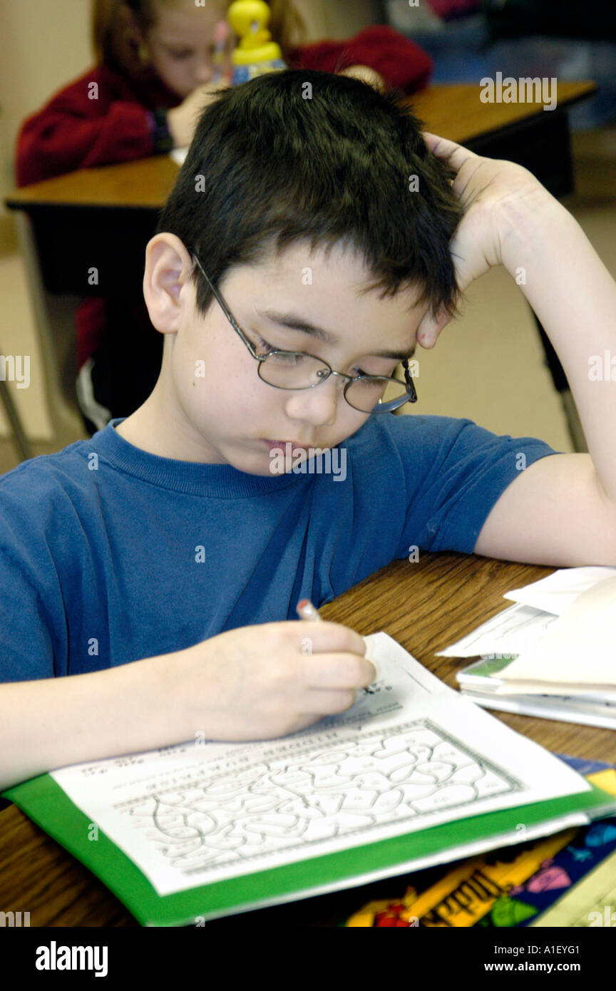 Boy student in an Elementary school learning situation Stock Photo - Alamy