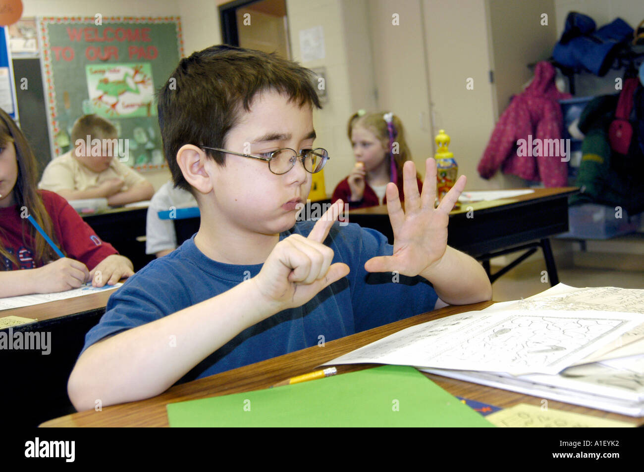 Boy and girl students in an Elementary school learning situation Stock ...