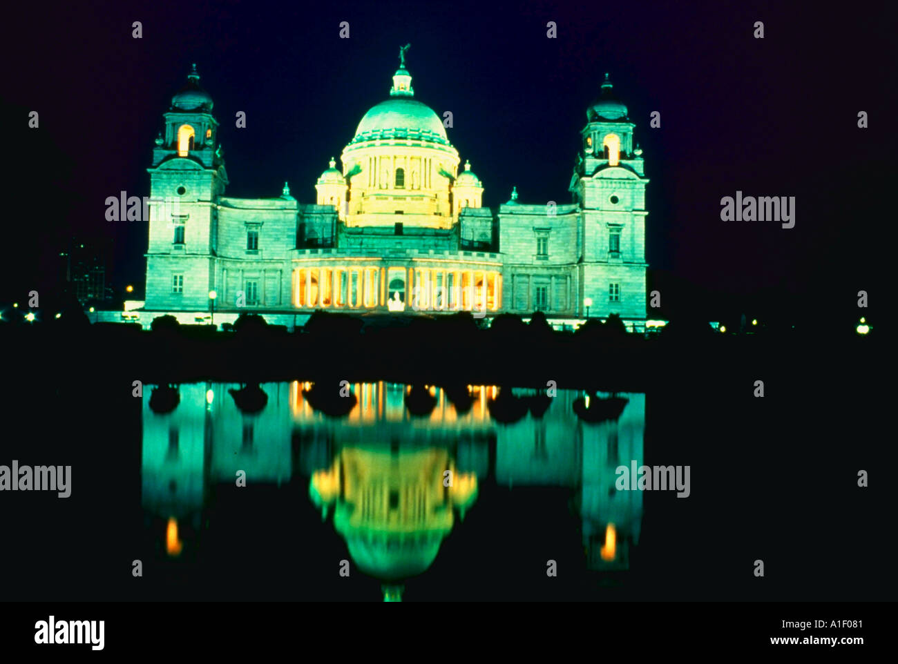 Victoria Memorial at night in Calcutta being reflected in the pool ...