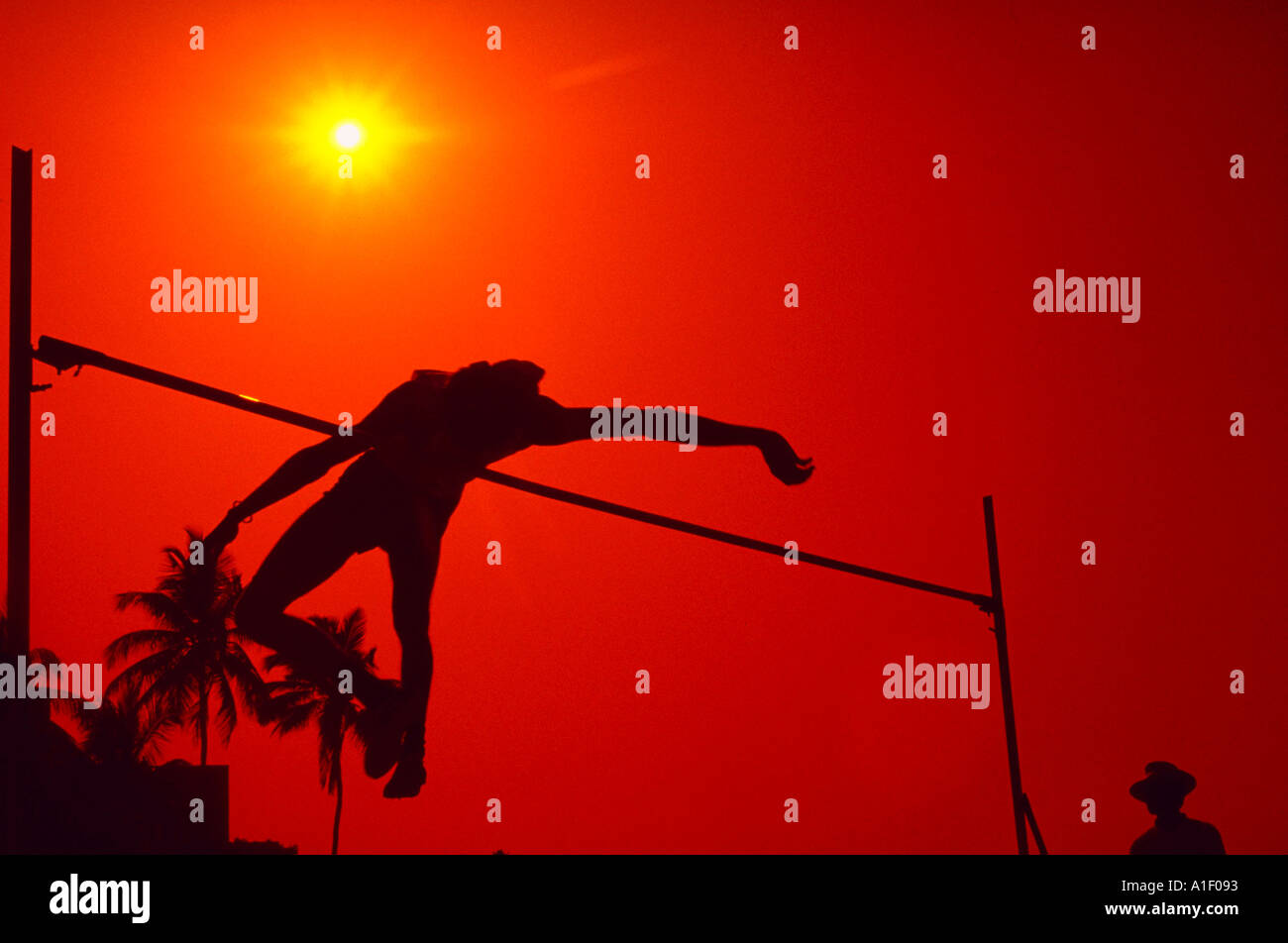 Athletic man jumping over bar hi-res stock photography and images - Alamy