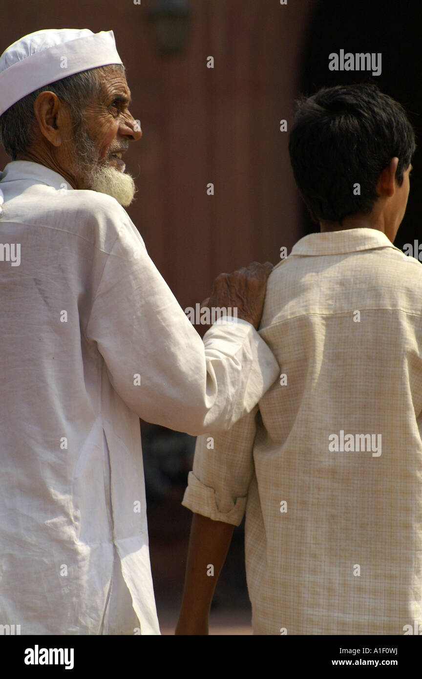 Old religious Muslim father man and son in Jama Masjid mosque, India ...