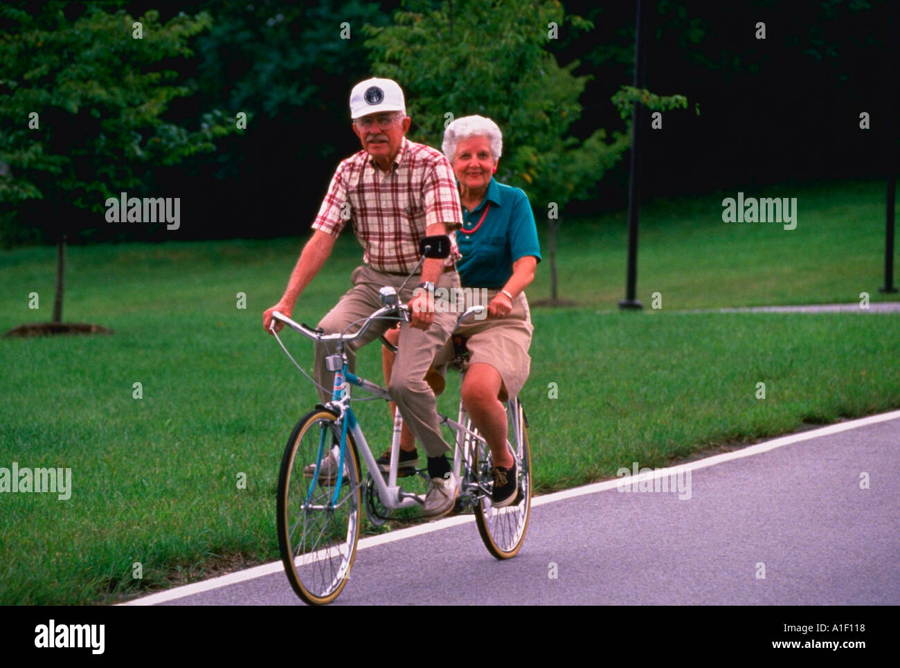 Family riding a tandem bicycle hi-res stock photography and images - Alamy