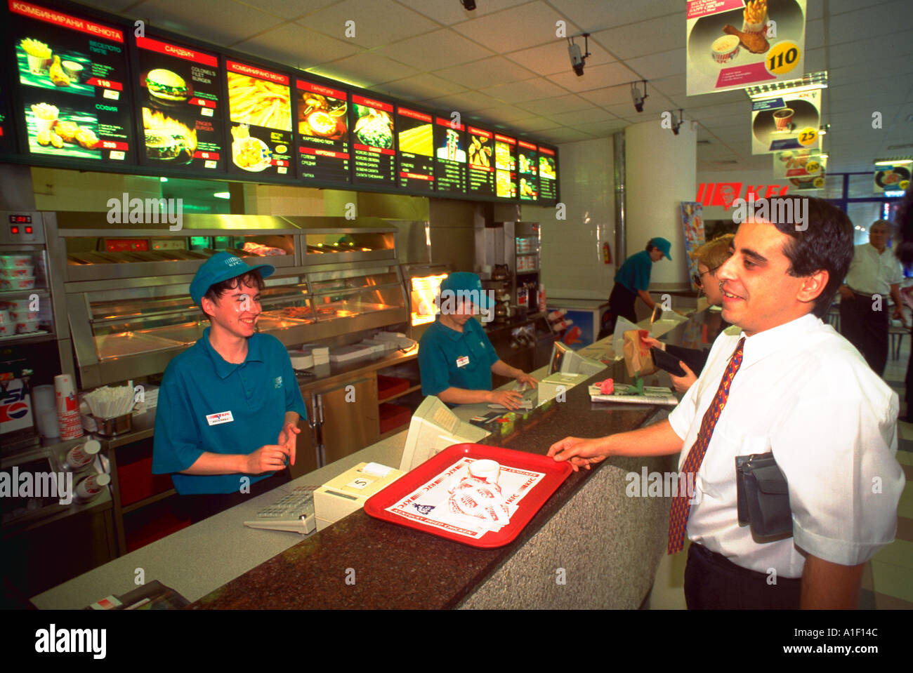 Customer and employee at Kentucky Fried Chicken restaurant in Sofia ...