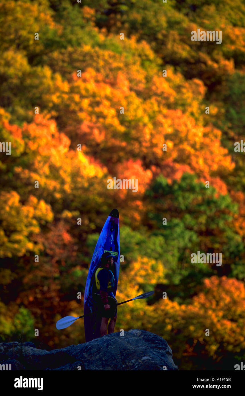 Kayaker with kayak standing on rock above Potomac River in Great Falls ...